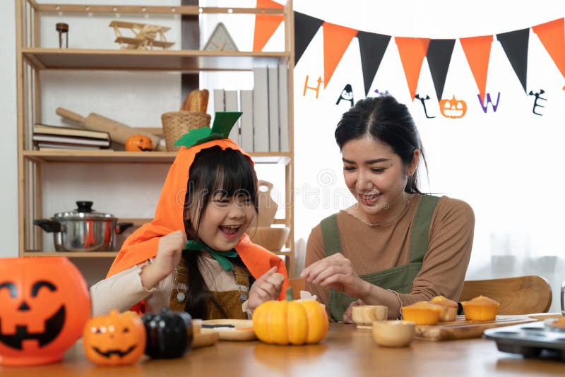 Happy Smiling Mom in the Kitchen Bakes Cookies with Her Daughter. Stock ...