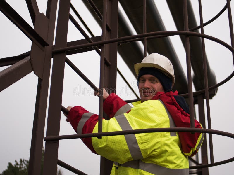Happy Smiling Worker in Helmet. Industrial Climber in Uniform Climbing ...