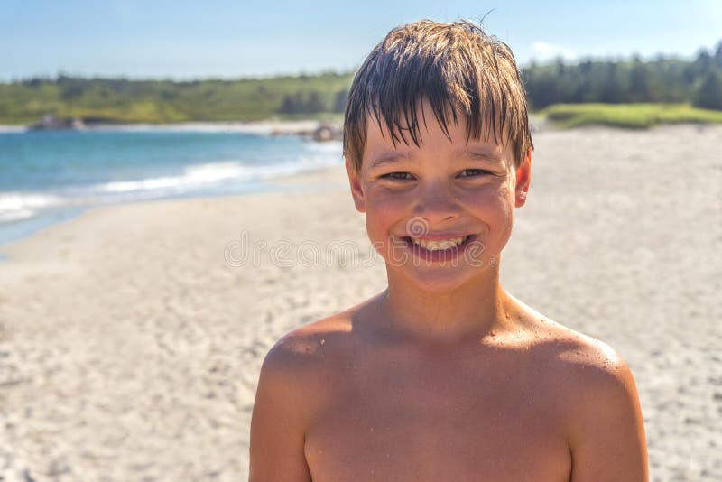 A Happy Smiling Young Boy at the Beach Stock Image - Image of body ...