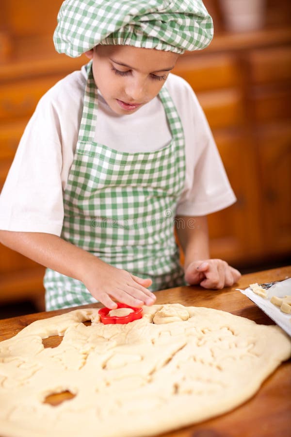 Happy Smiling Young Boy Chef in Kitchen Making Dough Stock Image ...