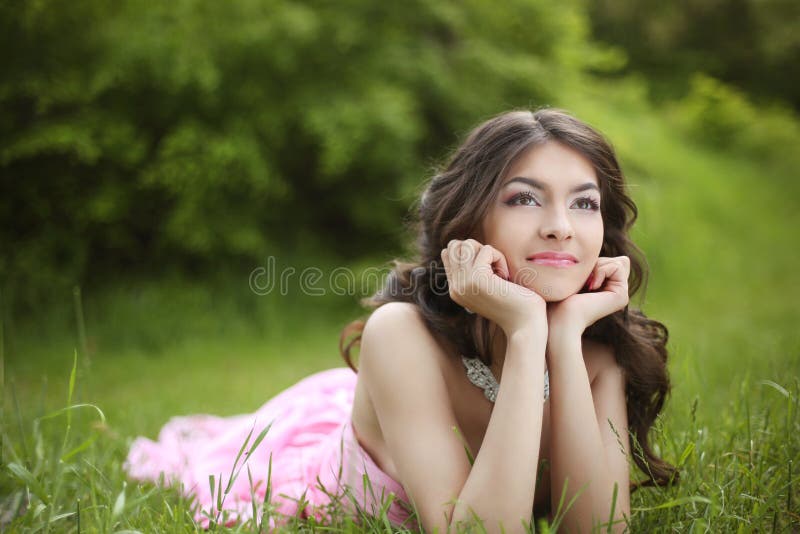 Happy Smiling Young Bride Girl Dreaming On Green Grass At Spring Stock