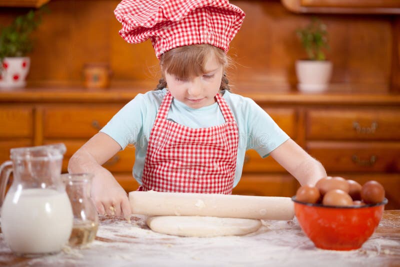 Happy Smiling Young Girl Chef in Kitchen Making Dough Stock Photo ...