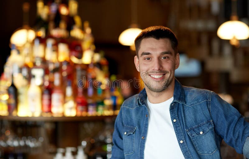 Happy Smiling Young Man at Bar or Pub Stock Photo - Image of male ...