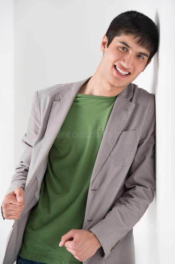Happy Smiling Young Man Leaning on Wall Stock Image - Image of arabian ...