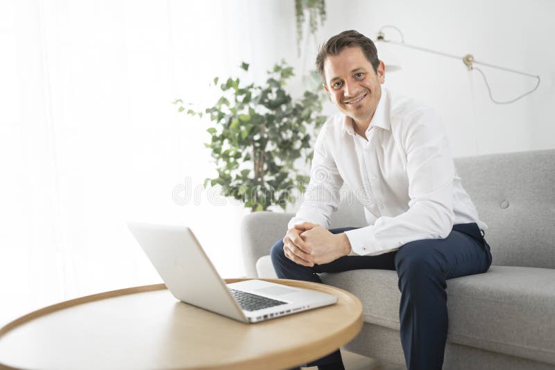 Happy Smiling Young Man Watching and Working on Computer Laptop at Home ...