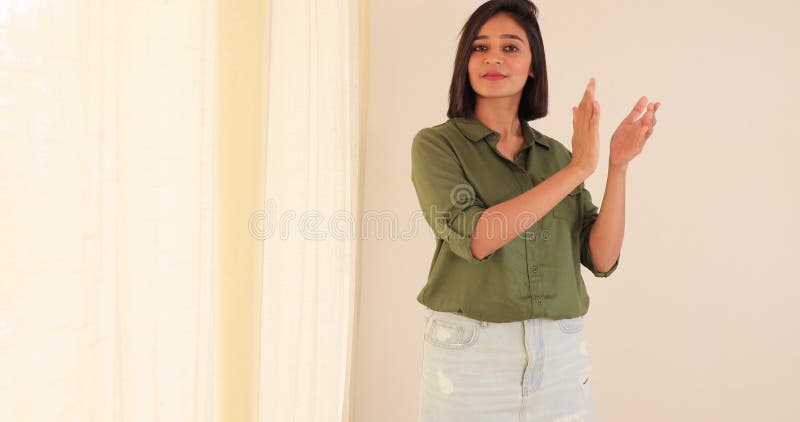 Young South Asian Woman Looking at Camera and Clapping, with Satisfied ...