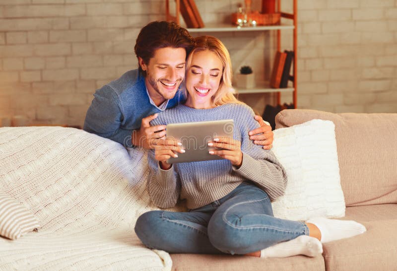 Happy Spouses Using Tablet Watching Film at Home Stock Image - Image of ...