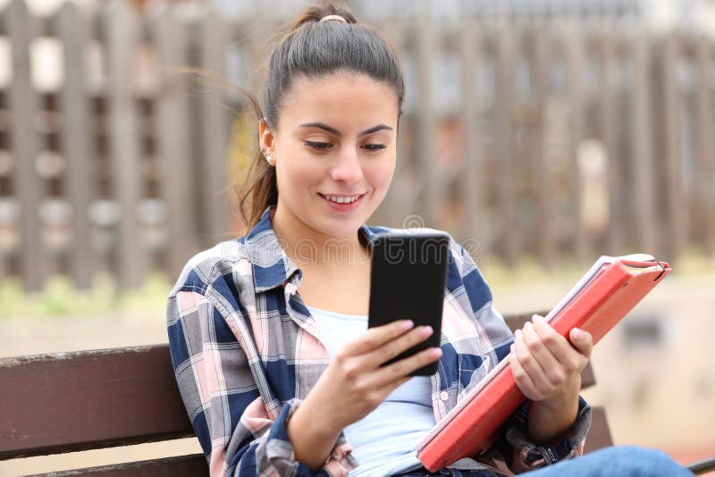 Happy Student Checking Smartphone in a Bench Stock Image - Image of ...