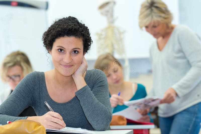 Happy student in classroom stock image. Image of class - 244998817
