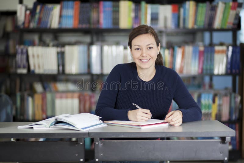 Happy Student Doing Homework Stock Photo - Image of female, young: 34348886