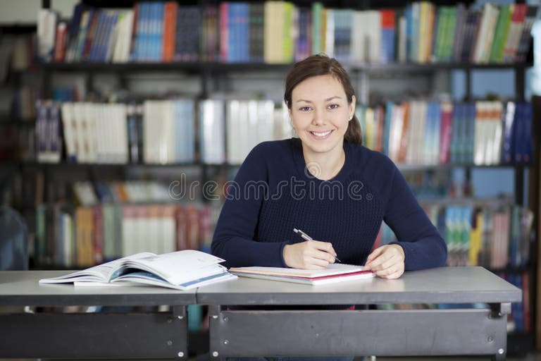 Happy Student Doing Homework Stock Photo - Image of female, young: 34348886