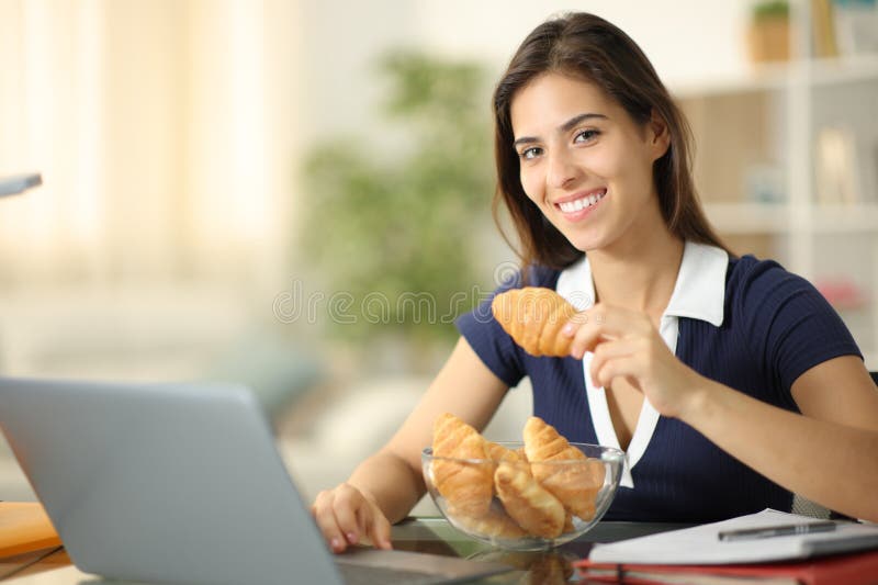 Happy Student E-learning Eating Croissants Stock Image - Image of food ...