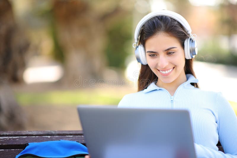 Happy Student Elearning Online in a Park Stock Photo - Image of music ...