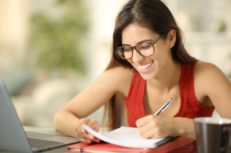 Happy Student with Eyeglasses Taking Notes at Home Stock Photo - Image ...