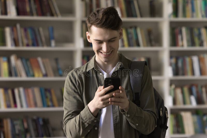 Happy Student Guy Using Learning Application for Study on Smartphone ...