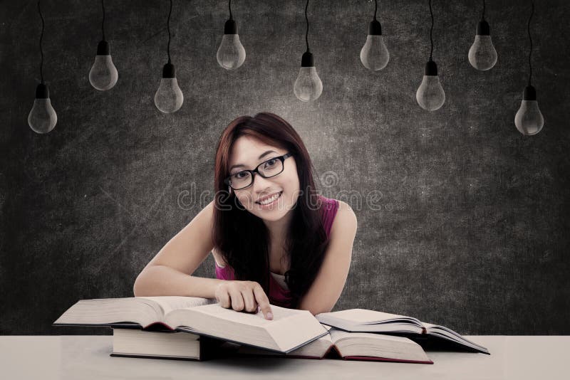 Happy Student Learning Under Light Bulbs Stock Image - Image of class ...