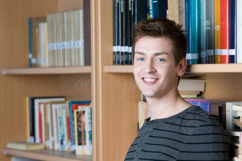 Happy student in a library stock image. Image of interior - 14184659
