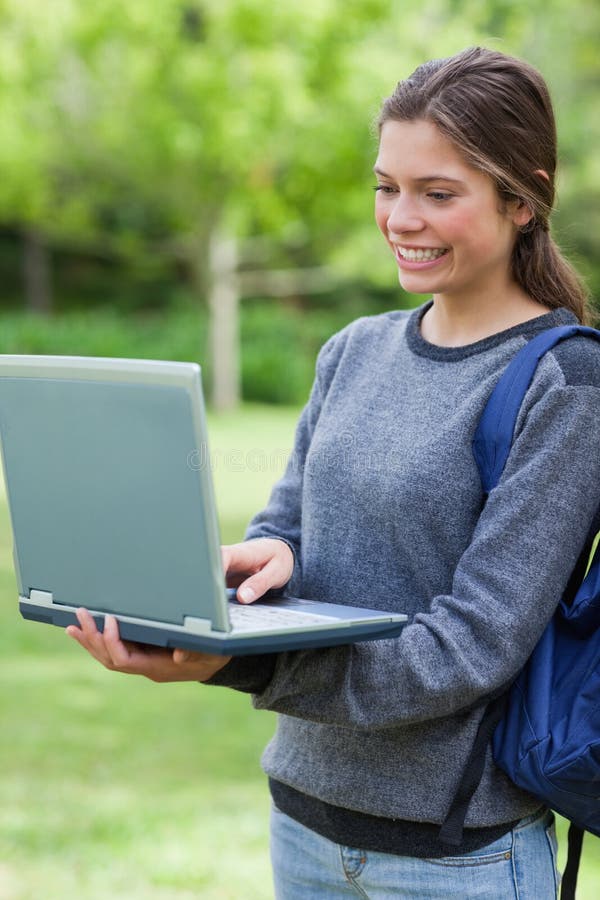 Happy Student Looking at the Screen of Her Laptop Stock Image - Image ...