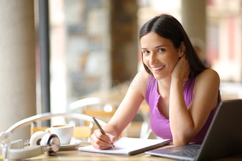 Happy Student Posing Taking Notes in a Bar Stock Image - Image of ...