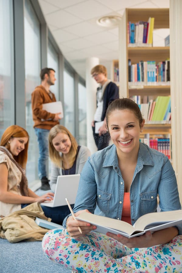 Happy Students Reading Books in Library Stock Image - Image of person ...