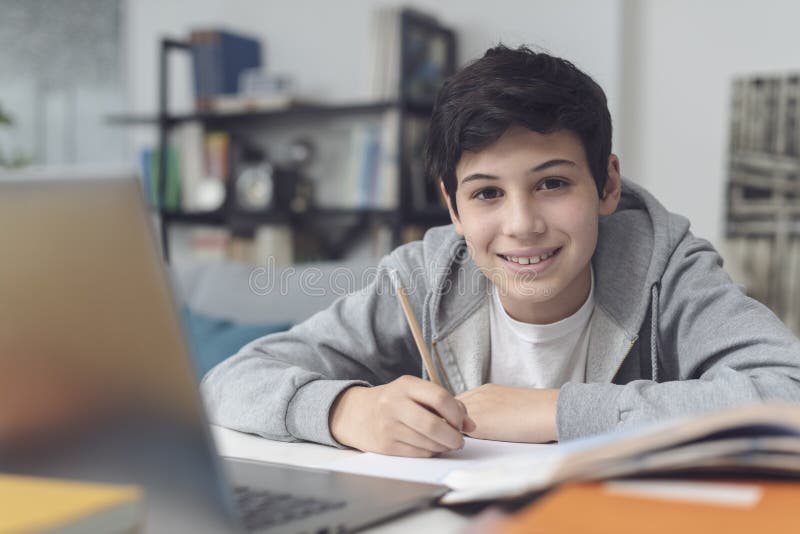 Happy Student Sitting at Desk and Studying Stock Photo - Image of ...