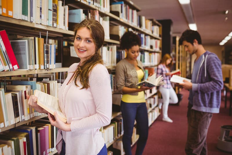Happy Student Taking Book from Shelf Stock Image - Image of caucasian ...