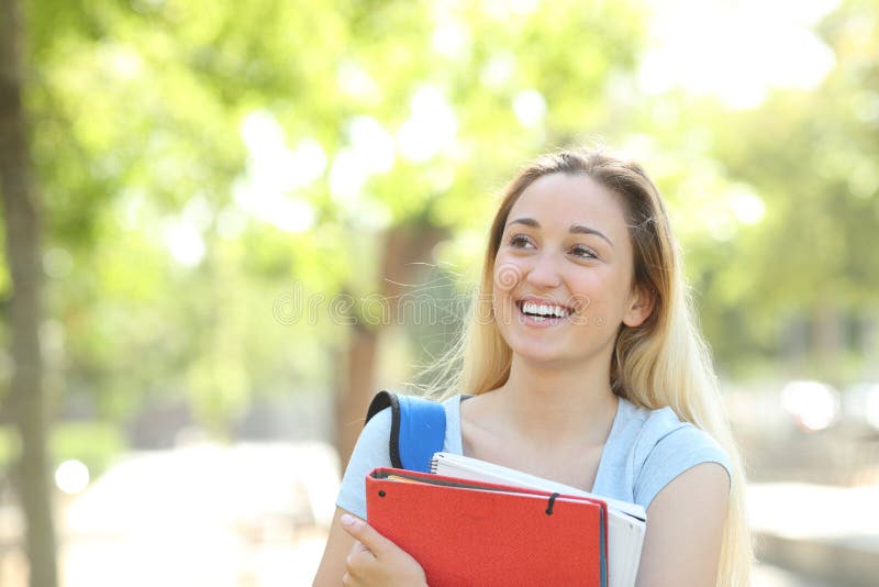 Happy Student Thinking Looking at Side in a Park Stock Photo - Image of ...