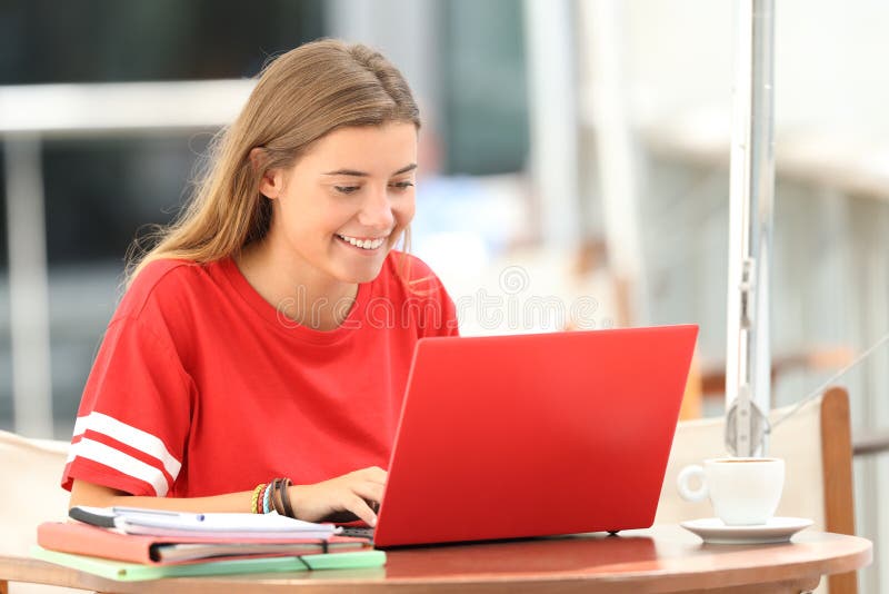 Happy Student Typing in a Laptop in a Bar Stock Photo - Image of ...