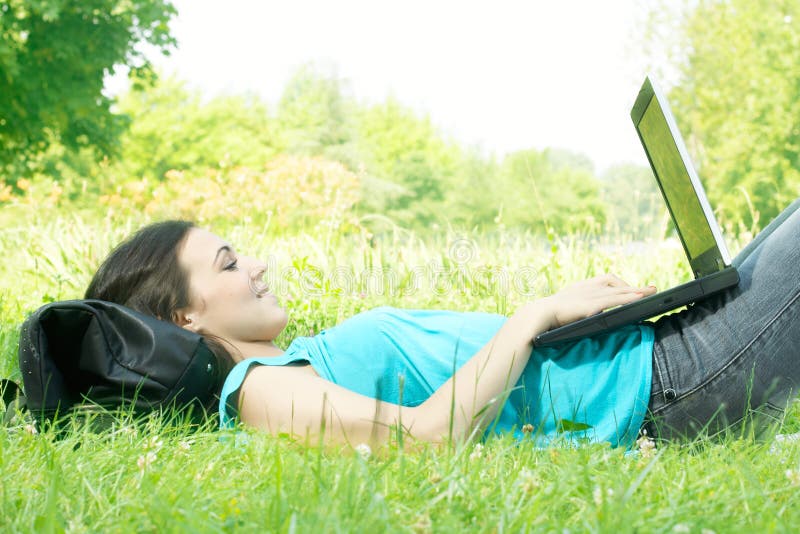 Happy student using laptop stock photo. Image of happy - 20097668