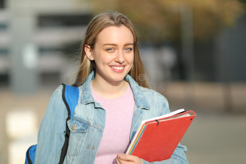 Happy Student Walking Looking at Camera in a Campus Stock Photo - Image ...