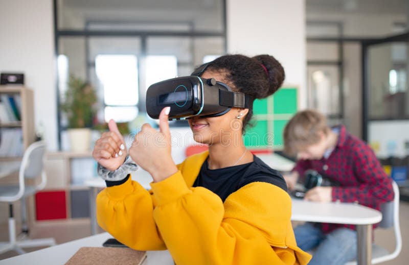 Happy Student Wearing Virtual Reality Goggles at School in Computer ...