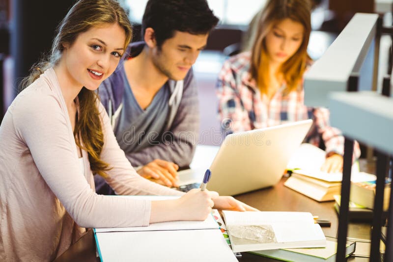 Happy Student Writing Her Notepad Smiling Camera Stock Photos - Free ...