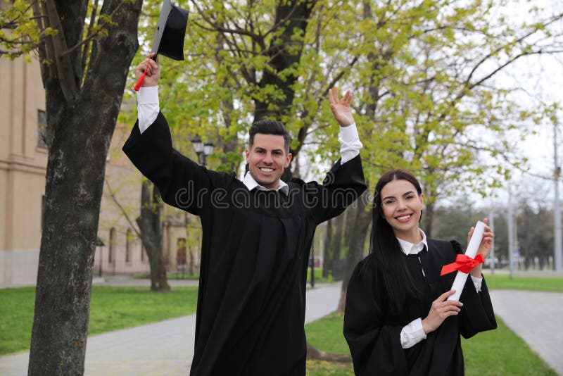 Happy Students with Diplomas after Graduation Ceremony Outdoors Stock ...