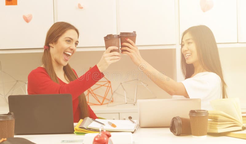 Happy students drinking stock image. Image of toned, beautiful - 71199907