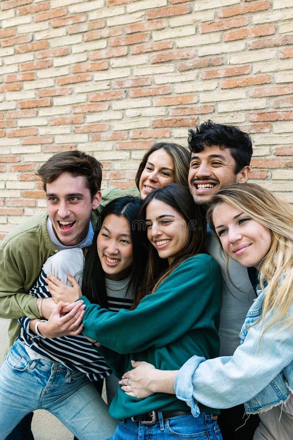 Happy Students Embracing and Smiling at University Campus Stock Image ...