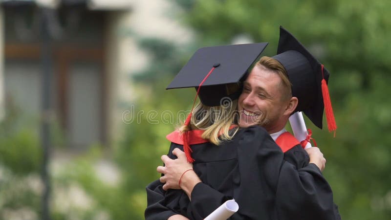 Happy Students Exchanging Congratulations, Hugging Warmly, Graduation ...