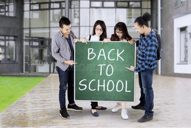 Happy Students Hold Back To School Text Stock Image - Image of full ...