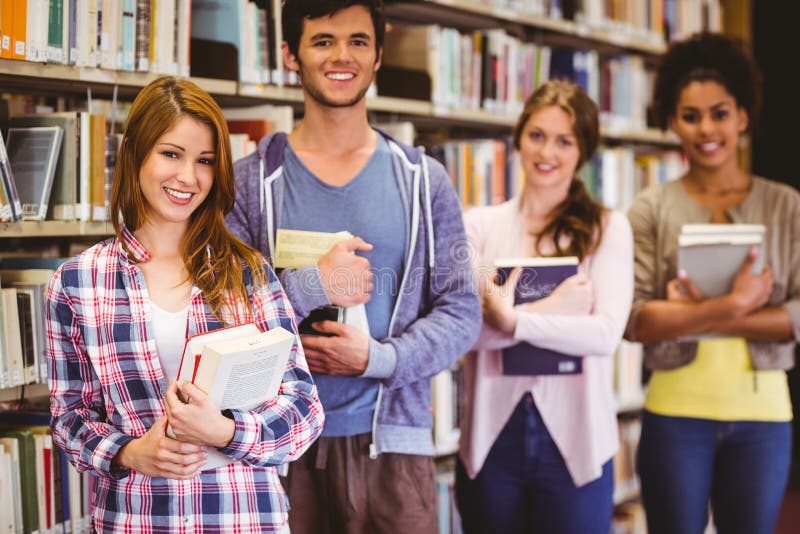 Happy Students Holding Books in Row Stock Photo - Image of people ...