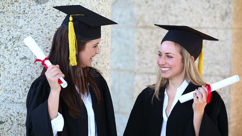 Students Holding Diplomas with Happy Graduation Day Banner in ...