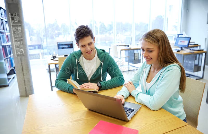Happy Students with Laptop and Books at Library Stock Photo - Image of ...