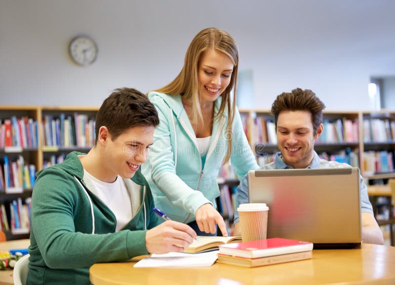 Happy Students with Laptop and Books at Library Stock Photo - Image of ...