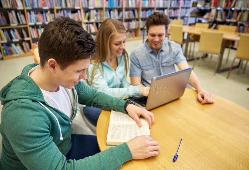 Happy Students with Laptop and Books at Library Stock Photo - Image of ...