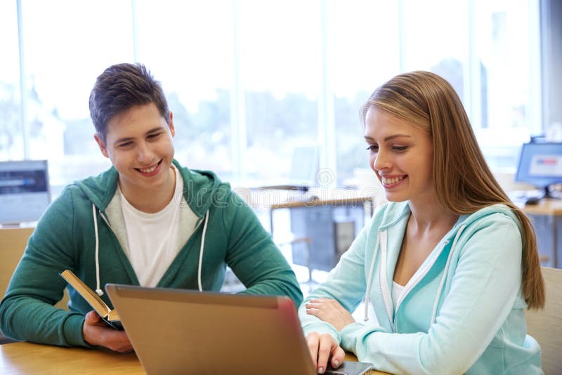 Happy Students with Laptop and Books at Library Stock Photo - Image of ...