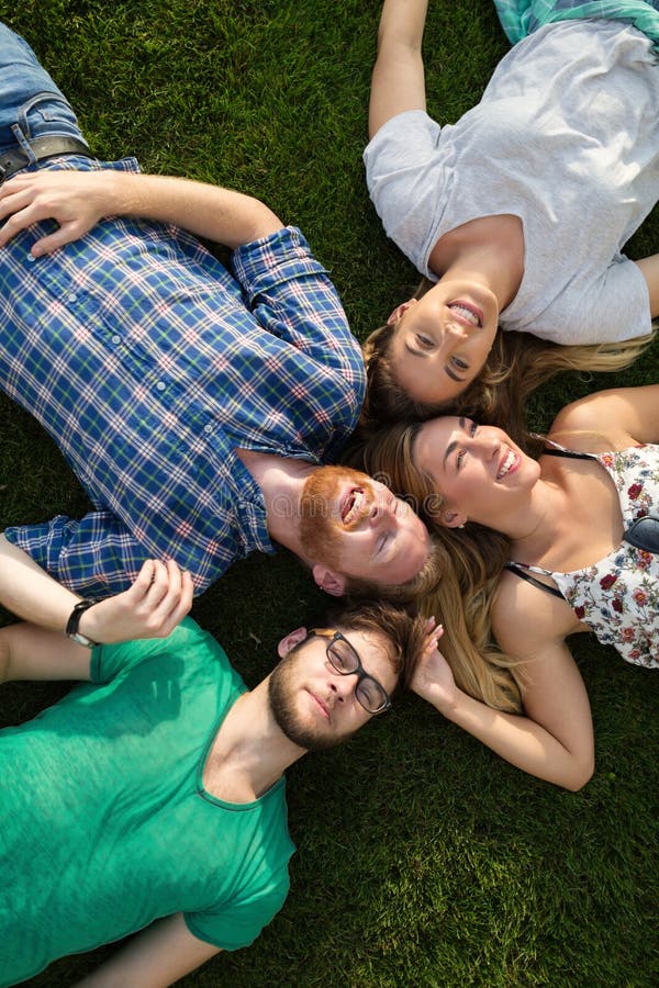 Happy Students Lying on Ground and Smiling Stock Image - Image of cool ...
