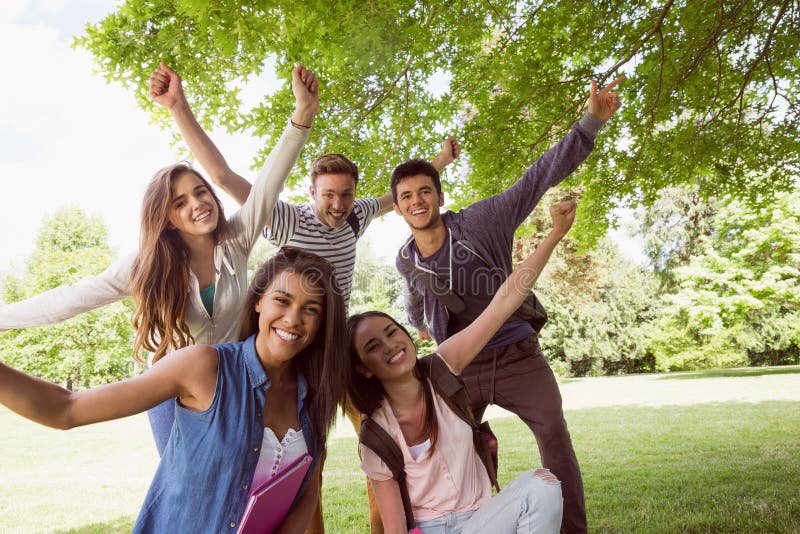 Happy Students Posing and Smiling Outside Stock Photo - Image of campus ...
