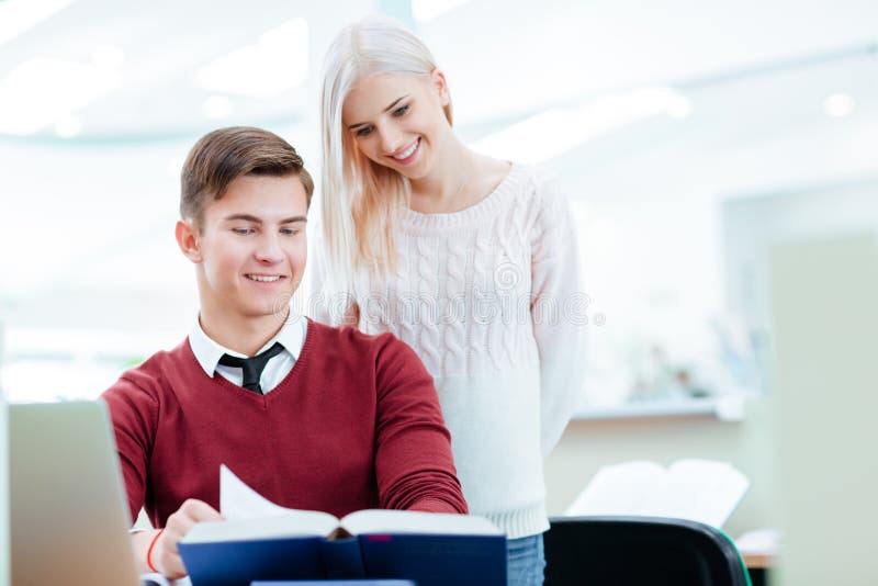 Happy Students Reading Book Together Stock Photo - Image of indoors ...