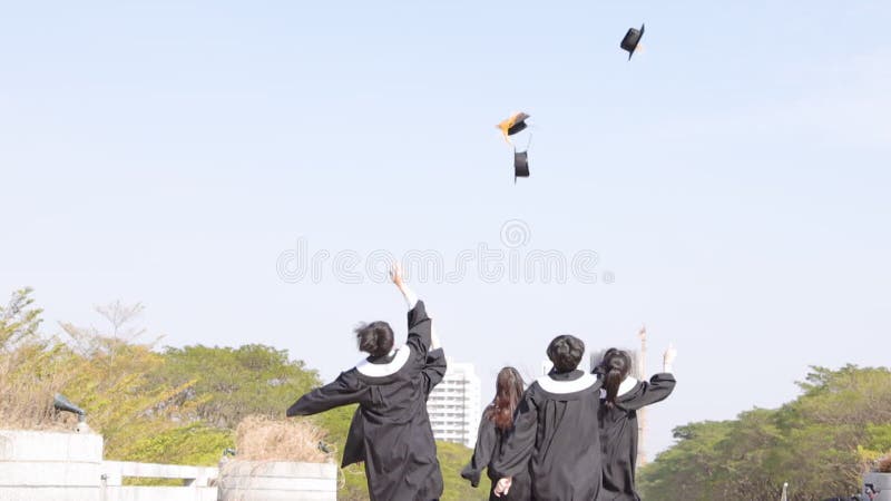 Happy Students Running and Throwing Graduation Hats in Air Stock Video ...