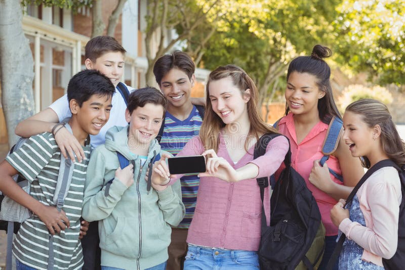 Happy Students Taking Selfie on Mobile Phone in Campus Stock Image ...