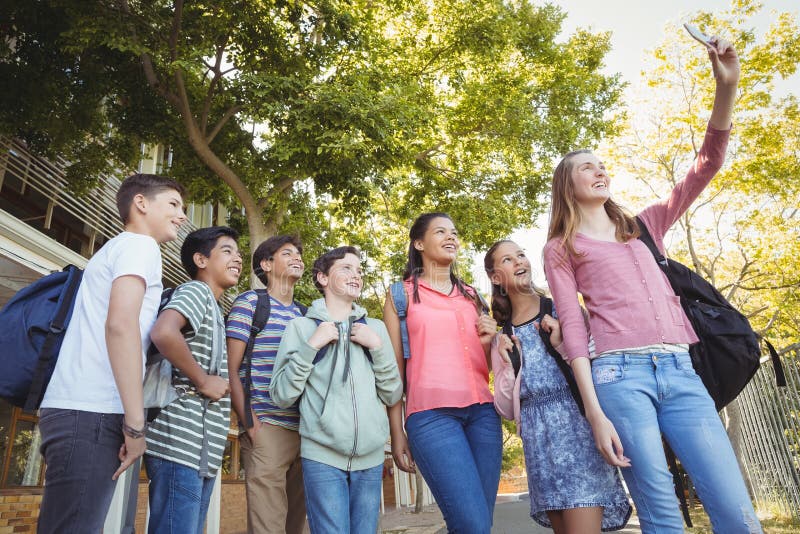 Happy Students Taking Selfie on Mobile Phone in Campus Stock Image ...