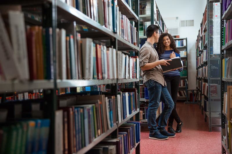 Happy Students Talking in Library Stock Photo - Image of cheerful ...